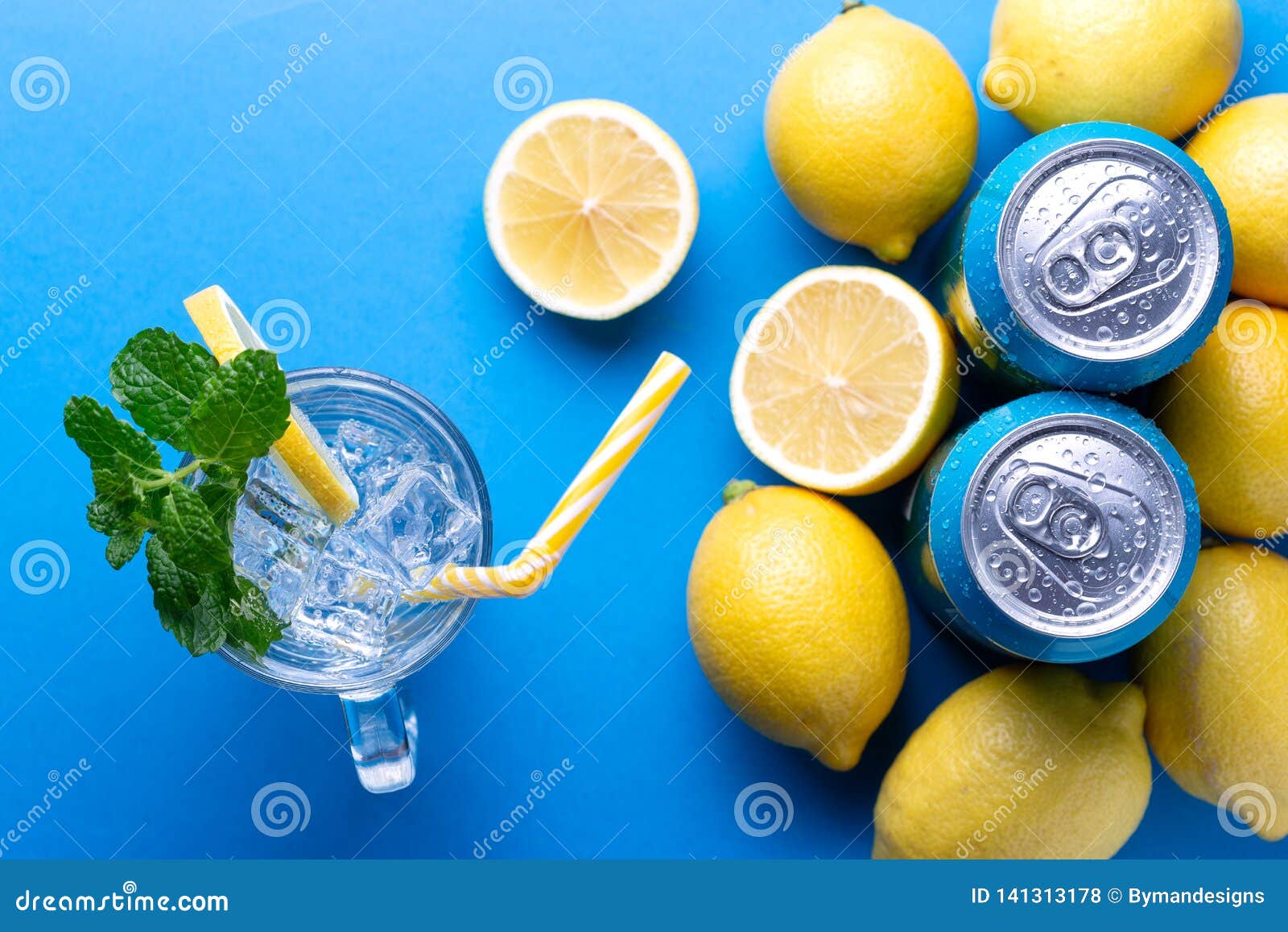 Soda pop cans and lemons stock photo. Image of close - 141313178