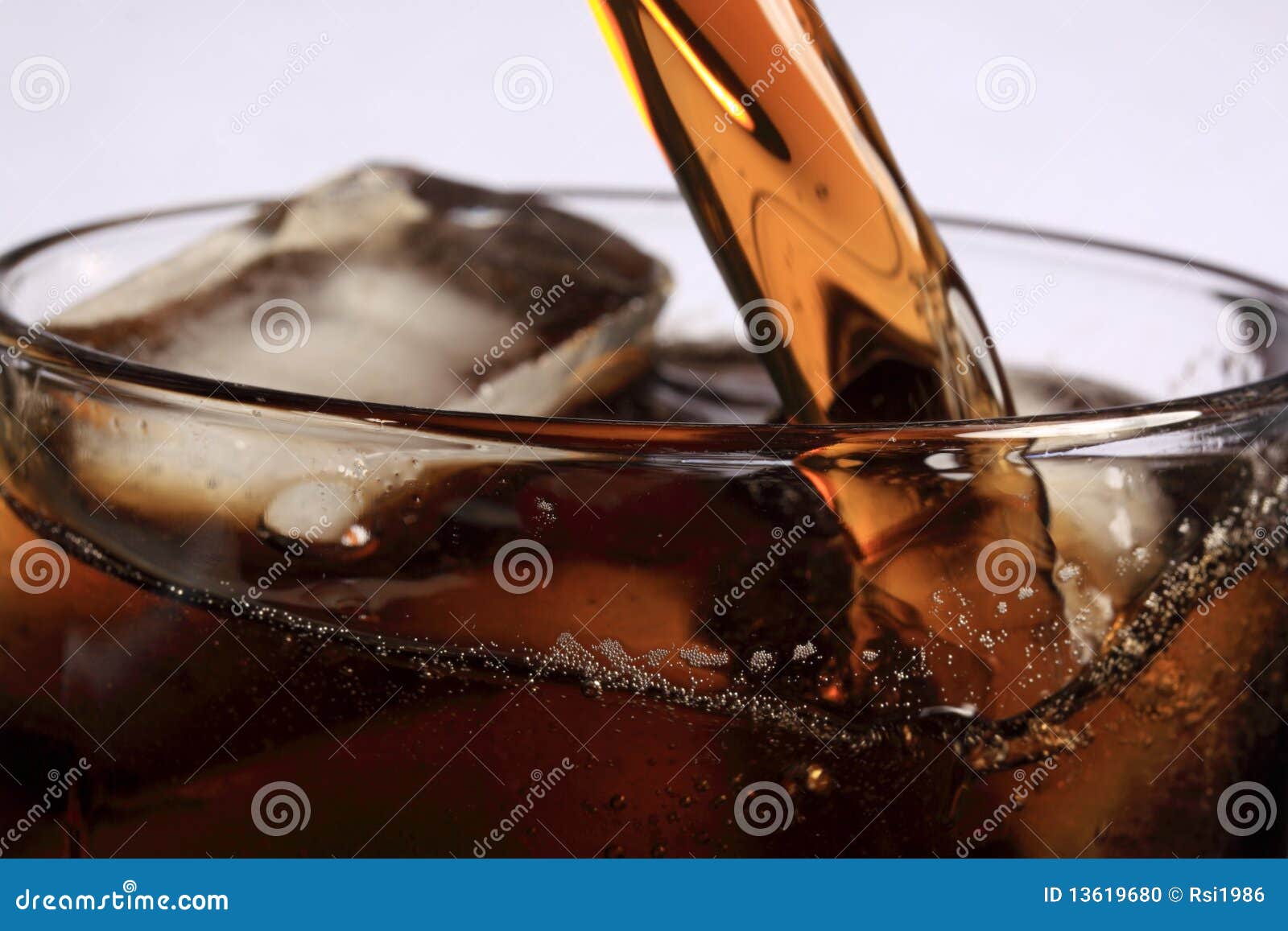 Soda Pouring Over Ice stock photo. Image of filling, beverage - 13619680