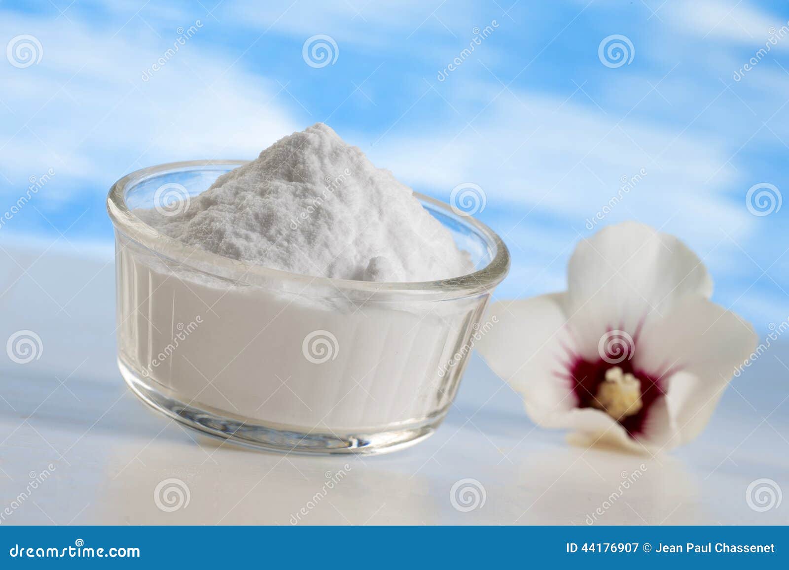 Sodium Bicarbonate In A Glass Jar With A Flower On A Blue Background ...