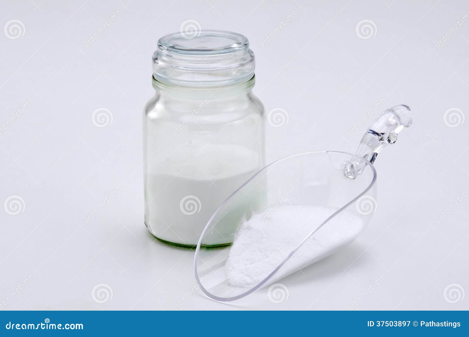 Sodium Bicarbonate In A Glass Jar With A Flower On A Blue Background ...