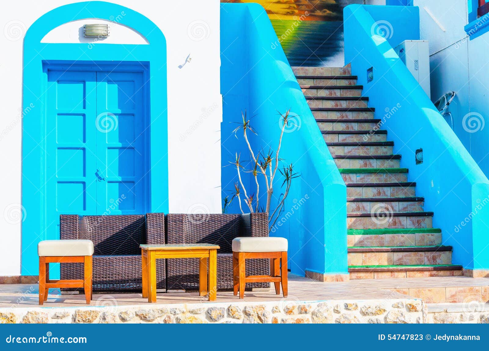 Sofa in Front of Greek House Painted with Blue Stock Image - Image of ...