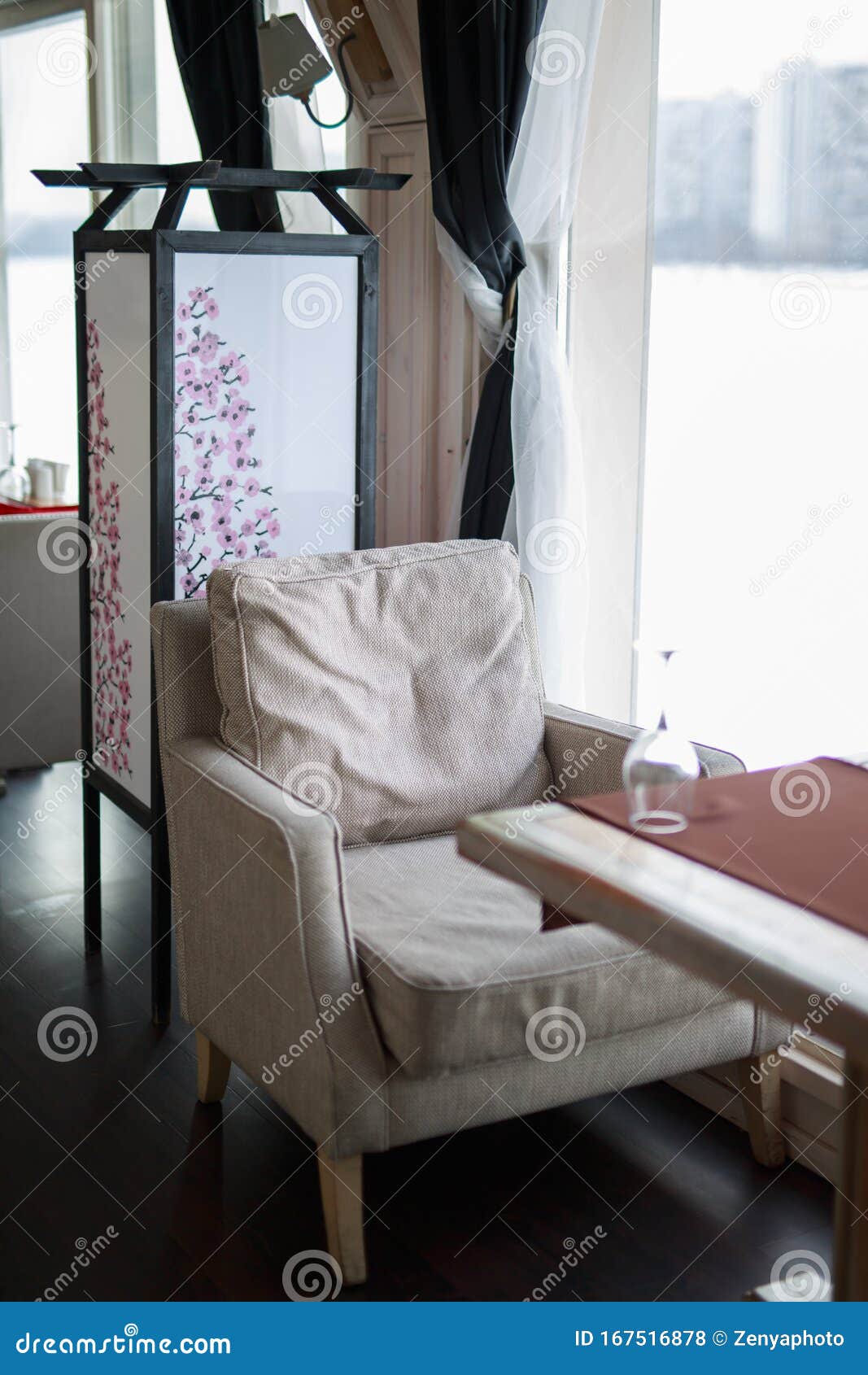 The Sofa Stands at a Large Light Table in a Light Wooden Stock Photo ...