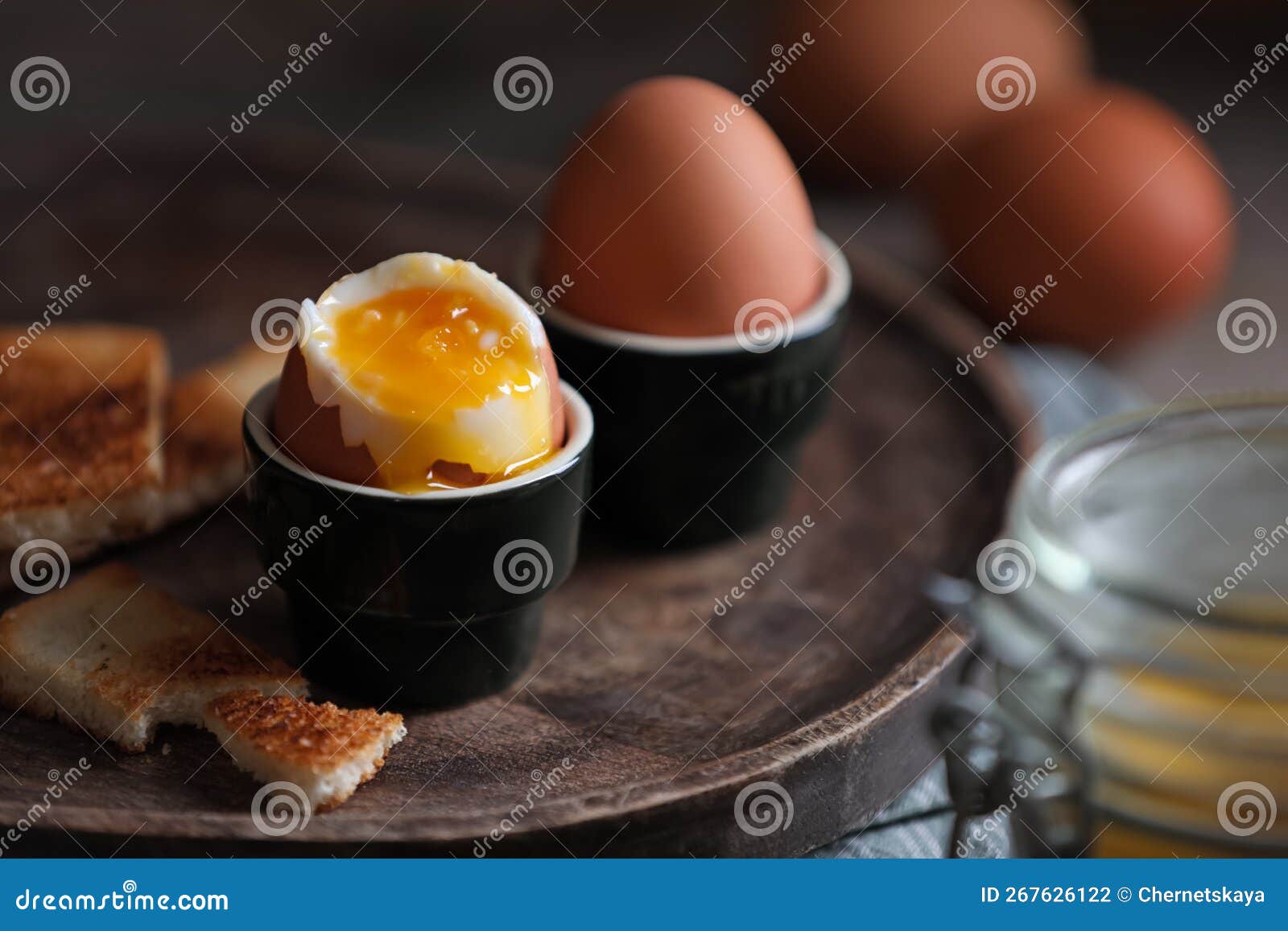 Soft Boiled Chicken Eggs with Toasted Bread on Wooden Table, Closeup ...