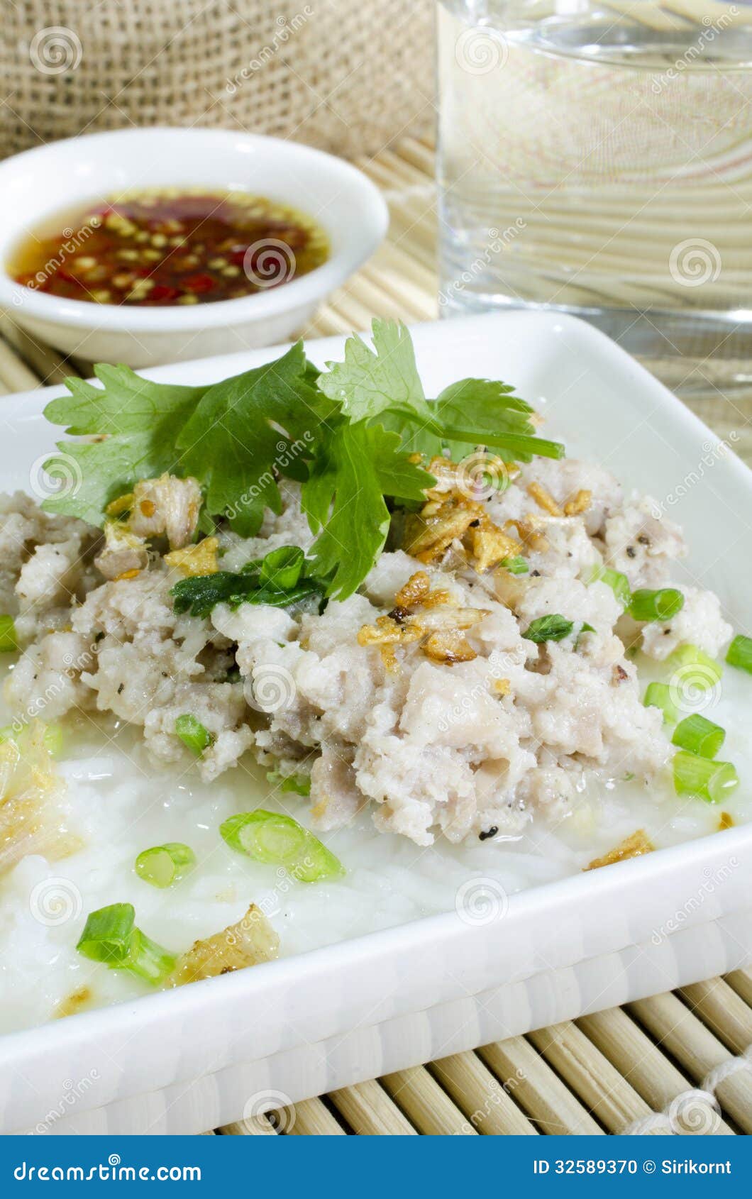 Soft-boiled Rice Pork with Glass of Water and Fish Sauce Stock Photo ...