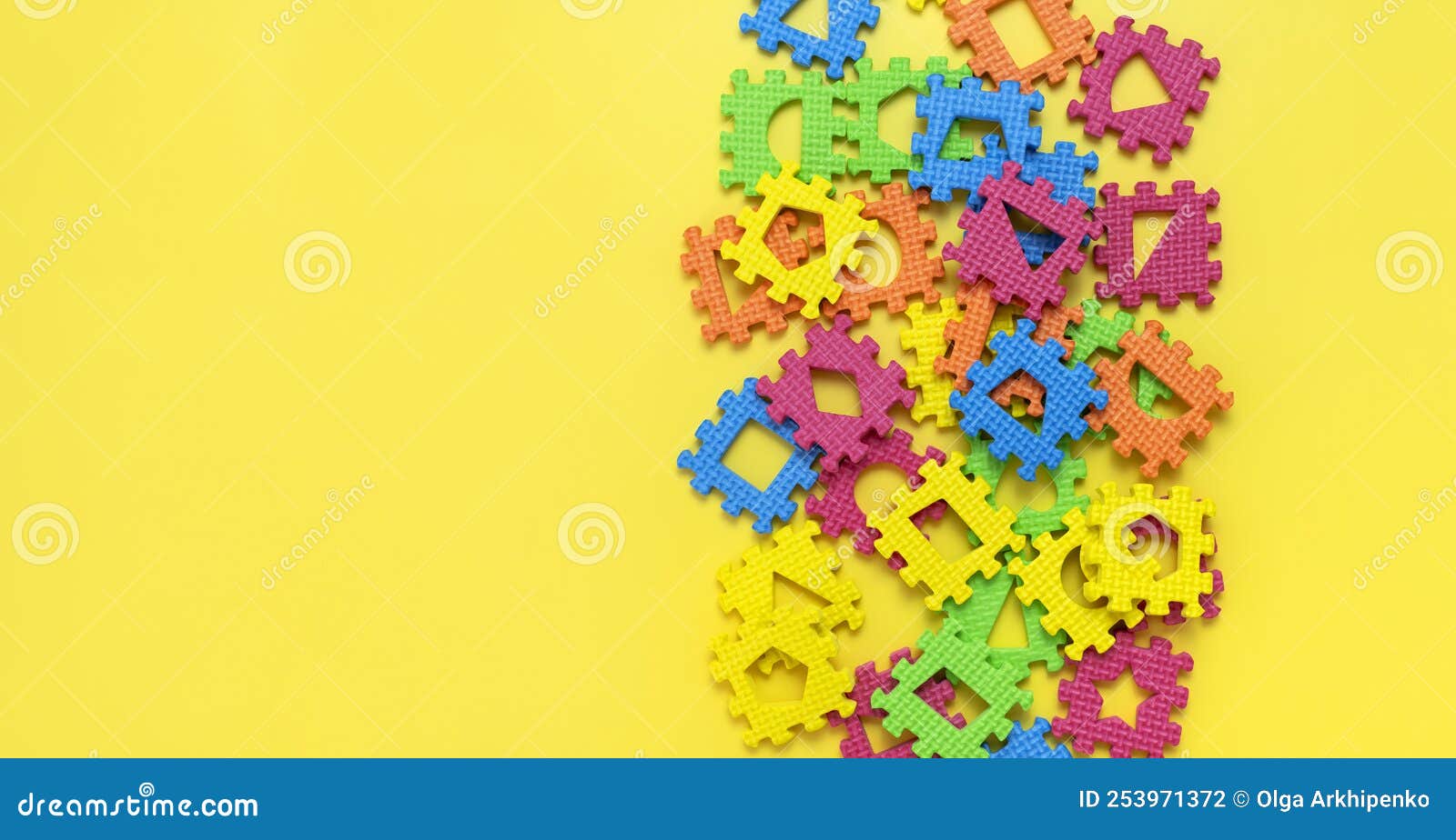 Colored Jigsaw Puzzle Pieces On Gray Background Top View. Concept For ...