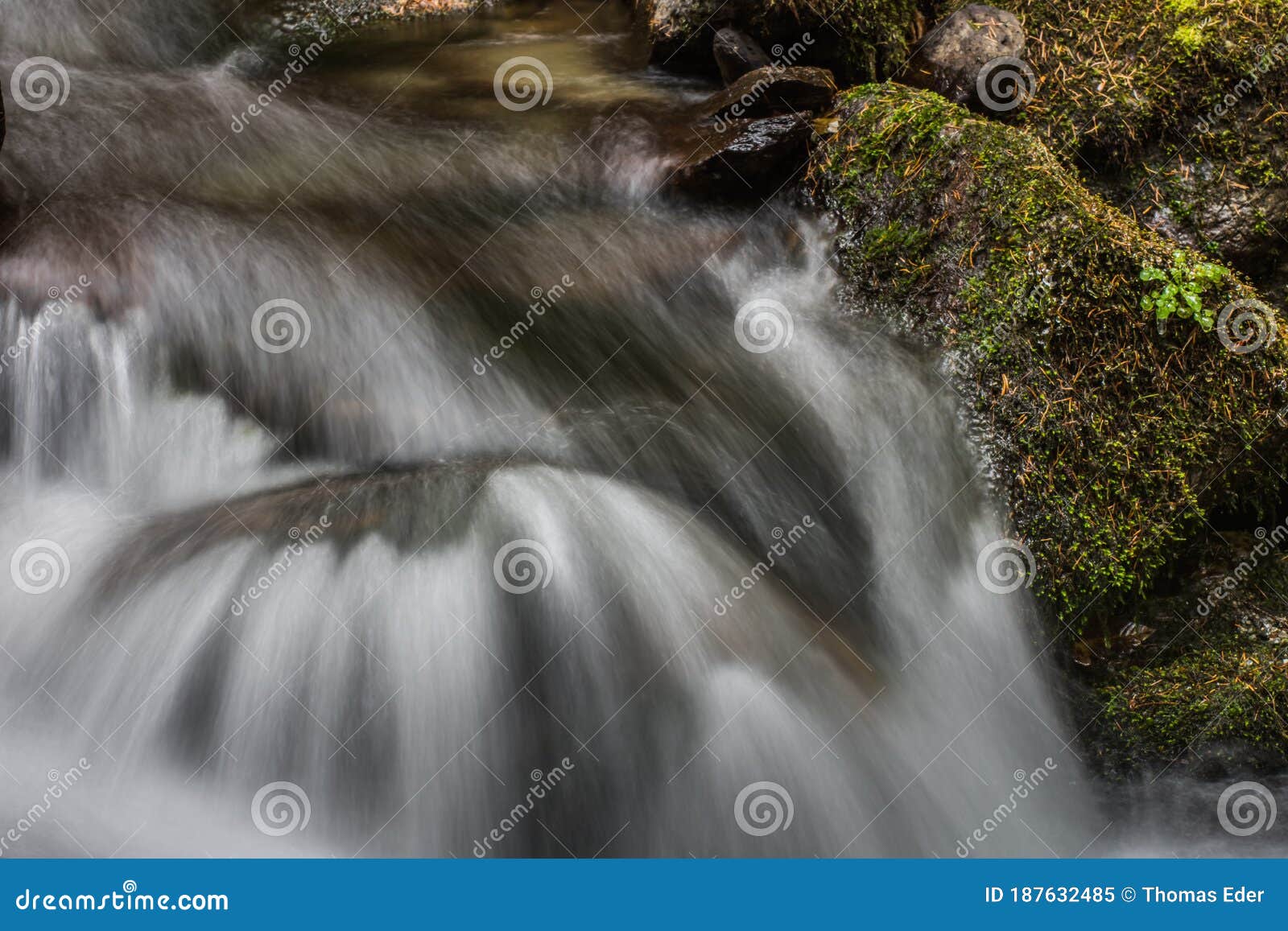 Soft Flowing Water in a Brook with Stones and Moss Stock Image - Image ...