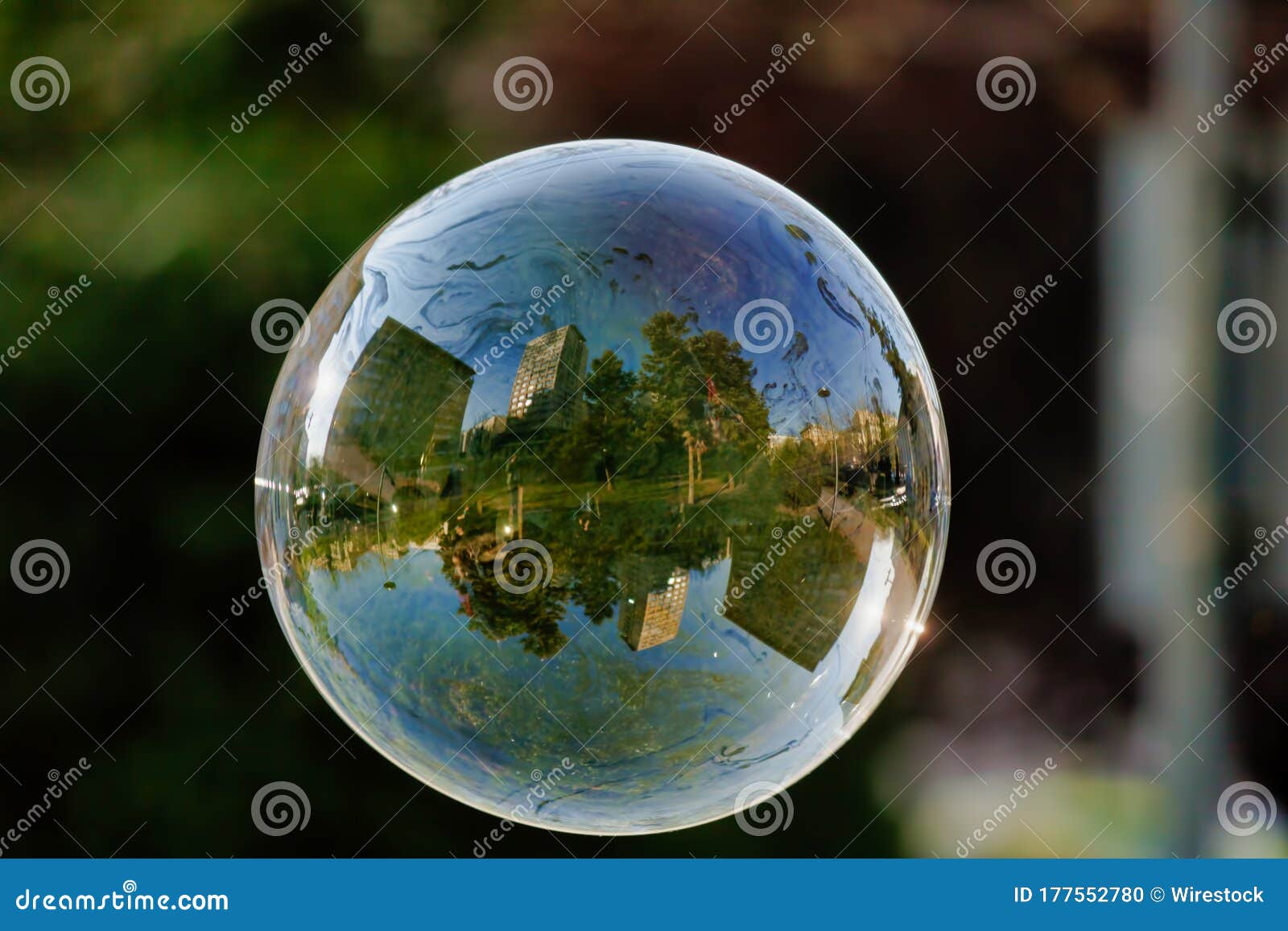 Soft Focus of a Bubble with Reflection of City Buildings and Trees on ...