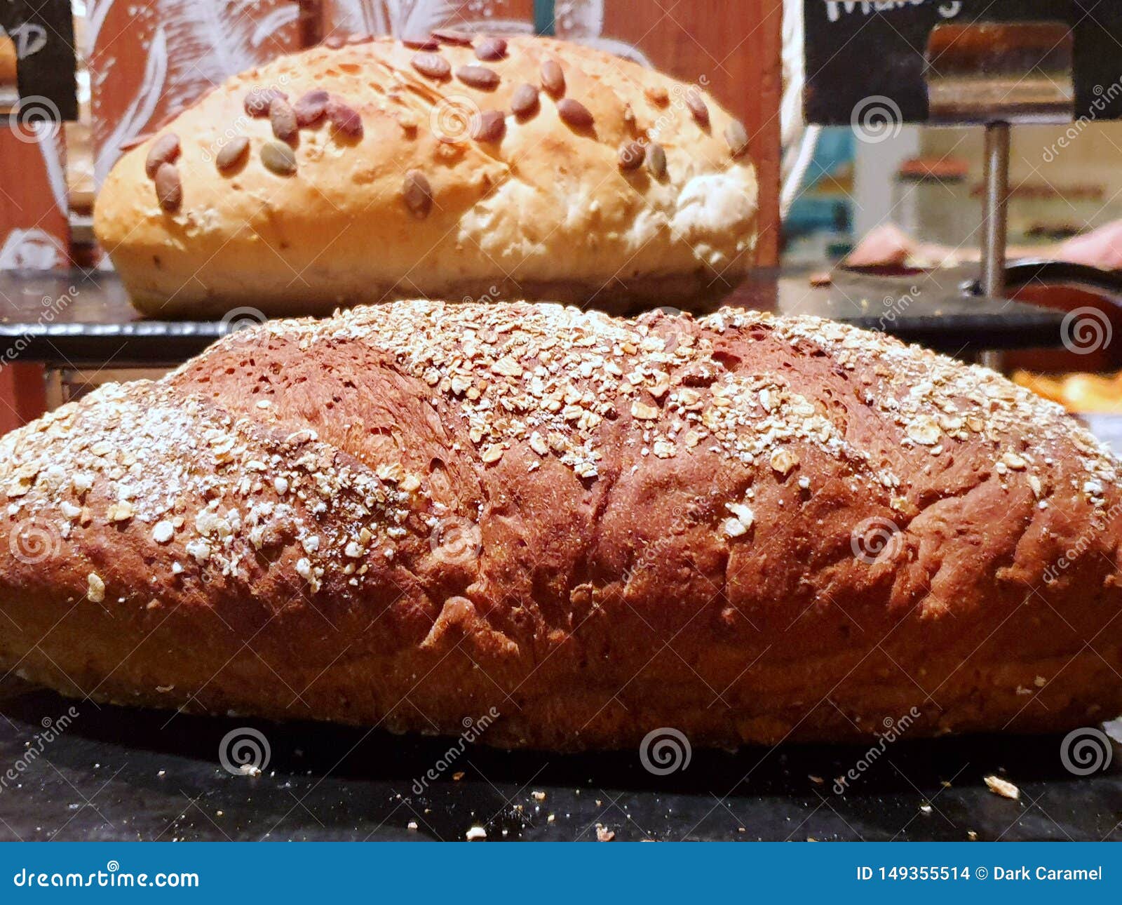 Soft Focus of Multigrain Bread on Black Plate in Restaurant Stock Photo ...
