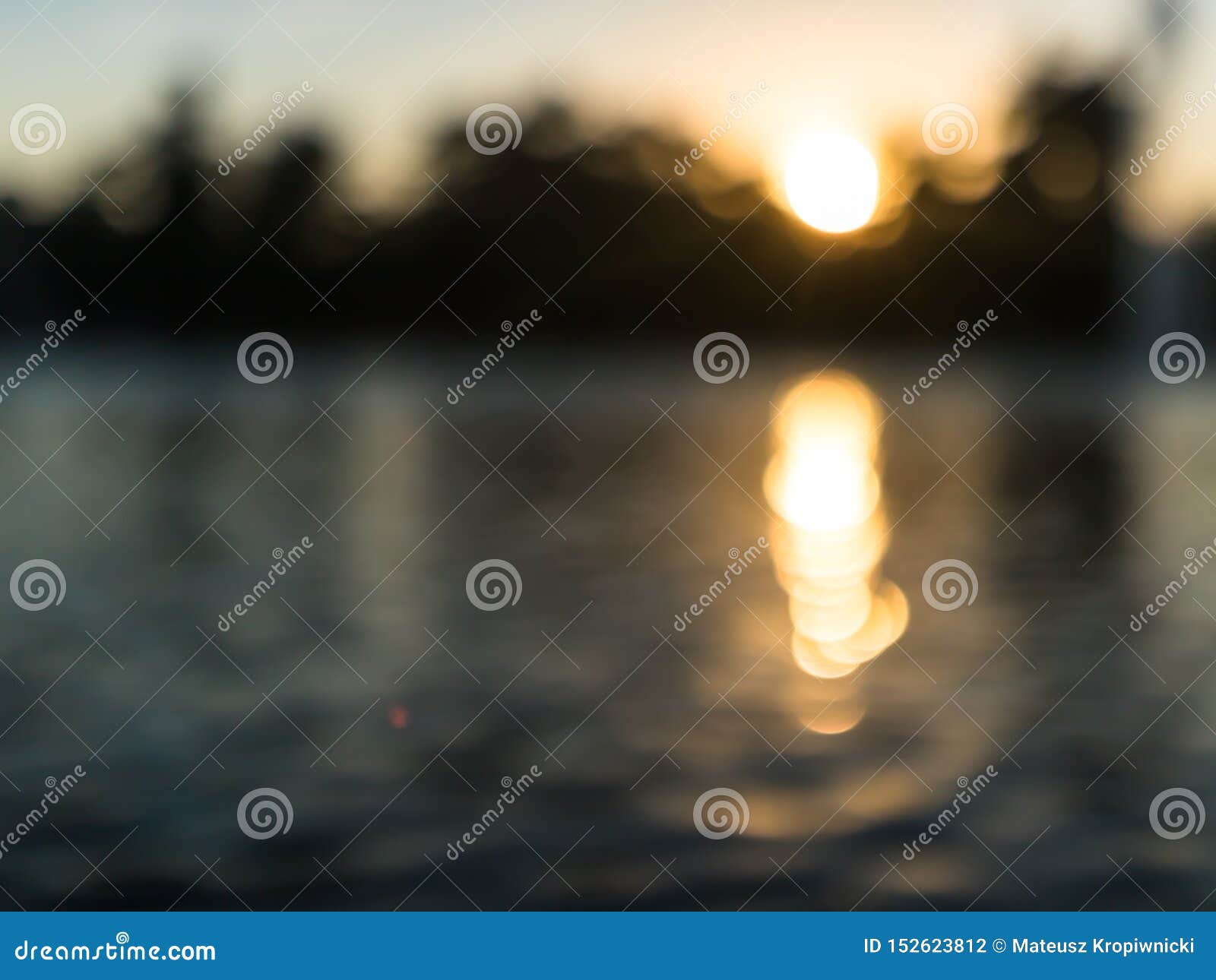 Sunset Reflecting on Water Surface Stock Photo - Image of blurred ...