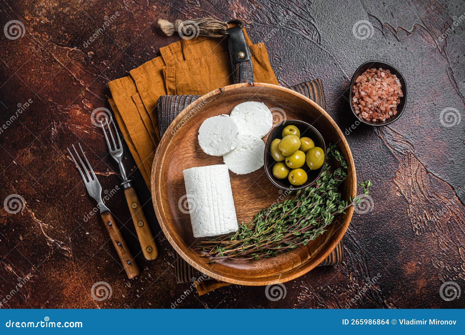 Soft Goat Cheese Chevre in a Plate with Thyme and Olives. Dark ...