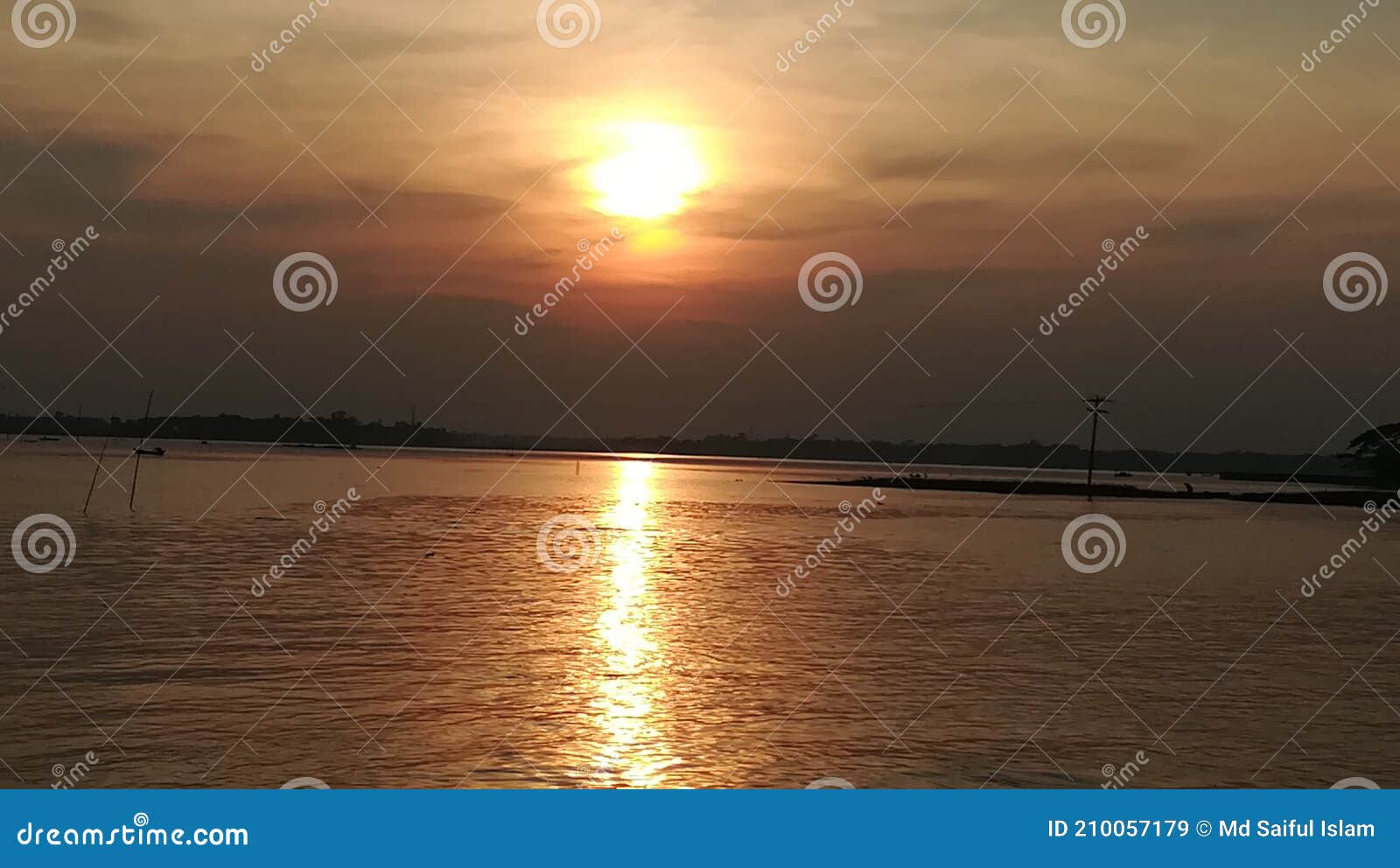 Bright Sunset Sky with a Reflection of the Sun on the River Bank in ...
