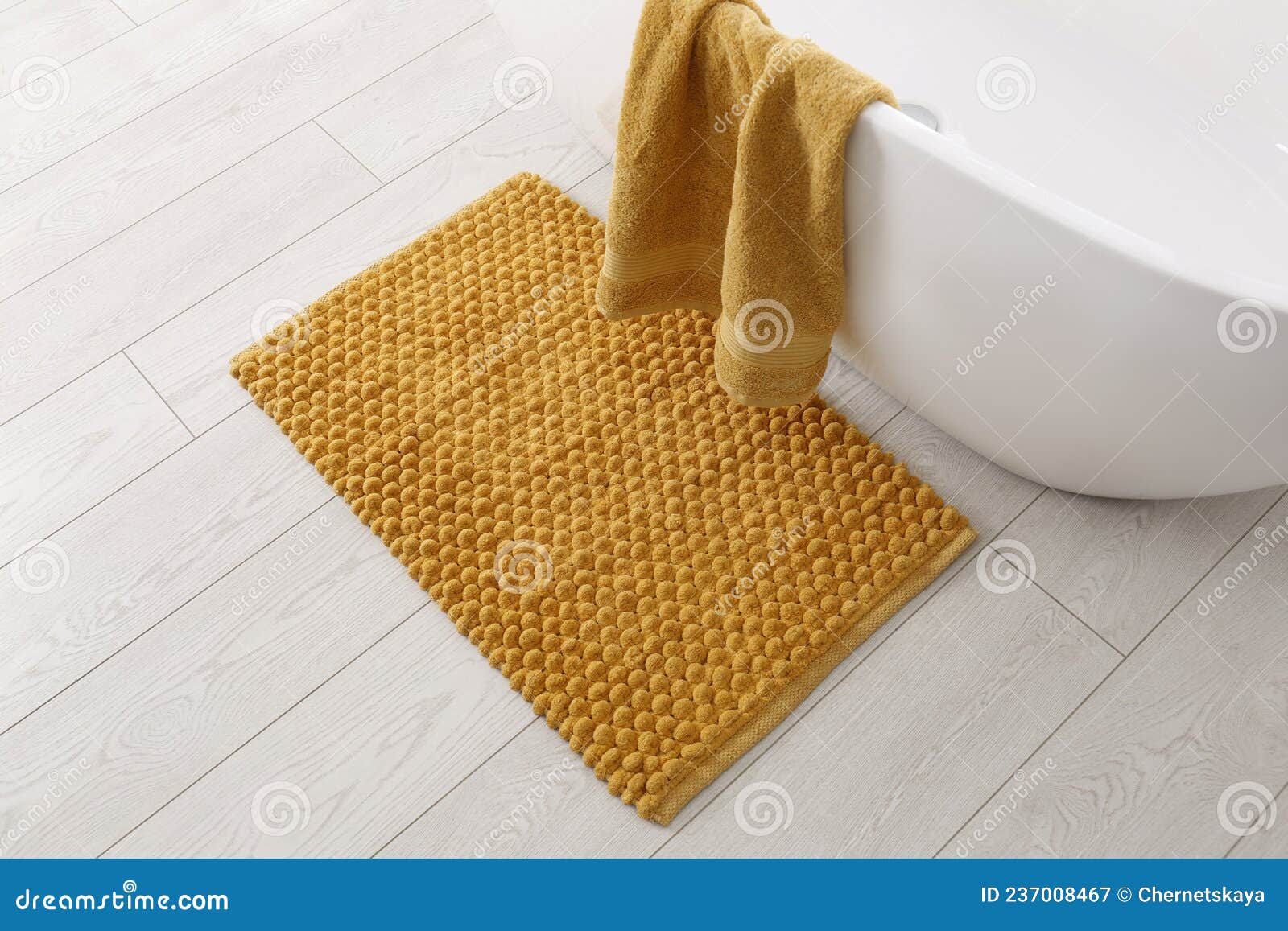 Soft Orange Bath Mat on Floor in Bathroom Stock Image - Image of ...