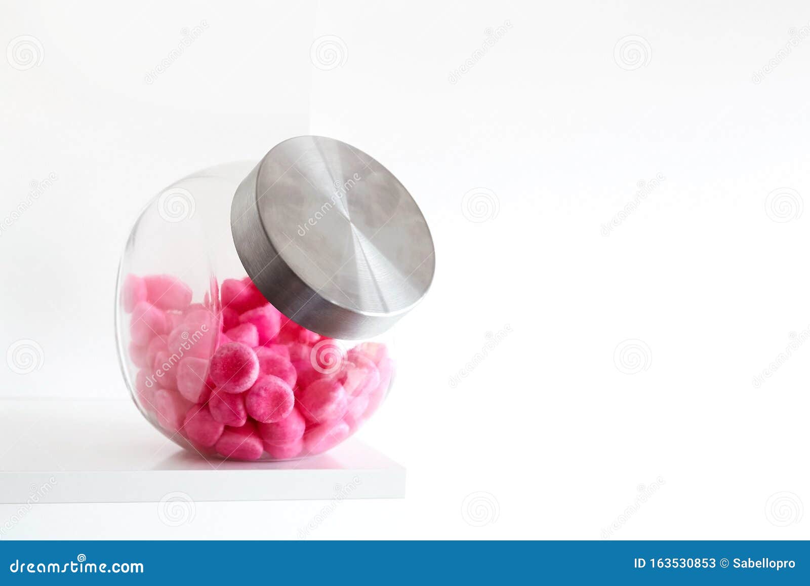 Soft Pink Candy in a Glass Jar on a White Shelf Stock Image - Image of ...