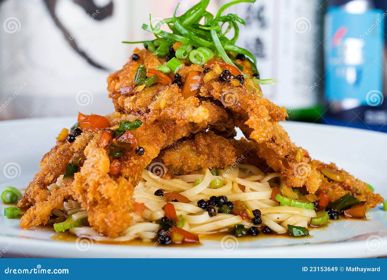 Soft Shell Crab Over a Bed of Noodles Stock Image - Image of onion ...