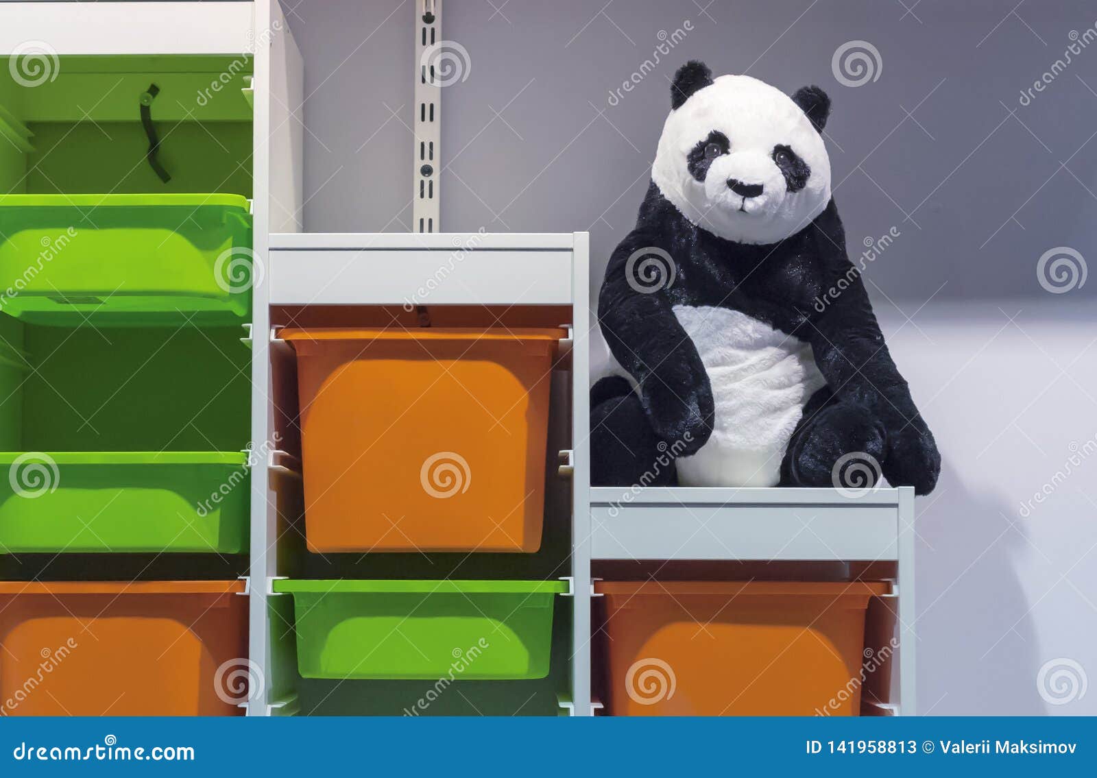 Soft Toy Panda on the Rack with Colored Plastic Boxes Stock Image ...