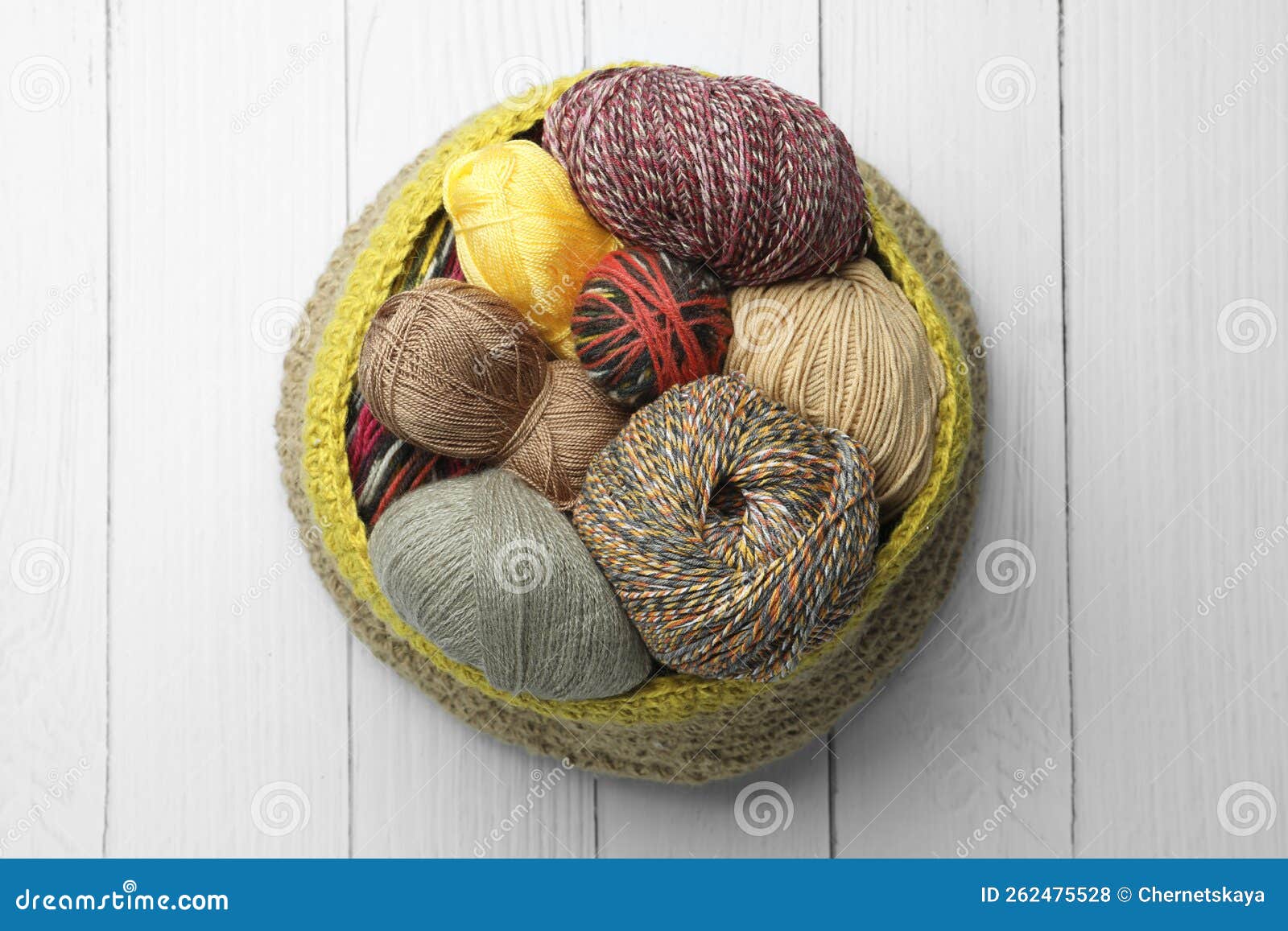 Soft Woolen Yarns on White Wooden Table, Top View Stock Photo - Image ...