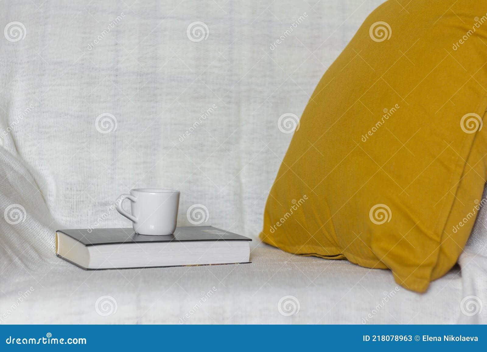 A Soft Yellow or Mustard-colored Pillow on a Cozy Sofa Stock Image ...