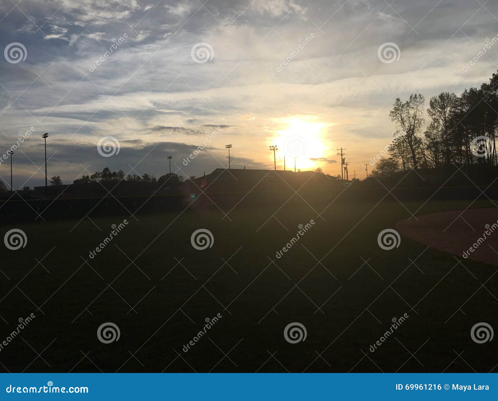 Softball game day stock photo. Image of sunset, field - 69961216