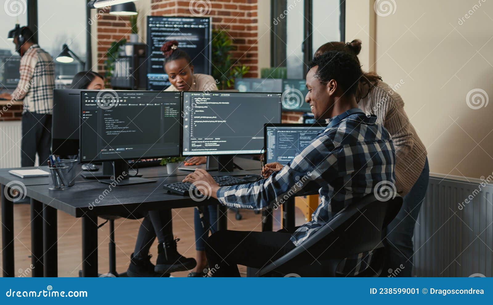Software Developer Looking at Running Code on Multiple Screens Takes Off Glasses and Doing High ...