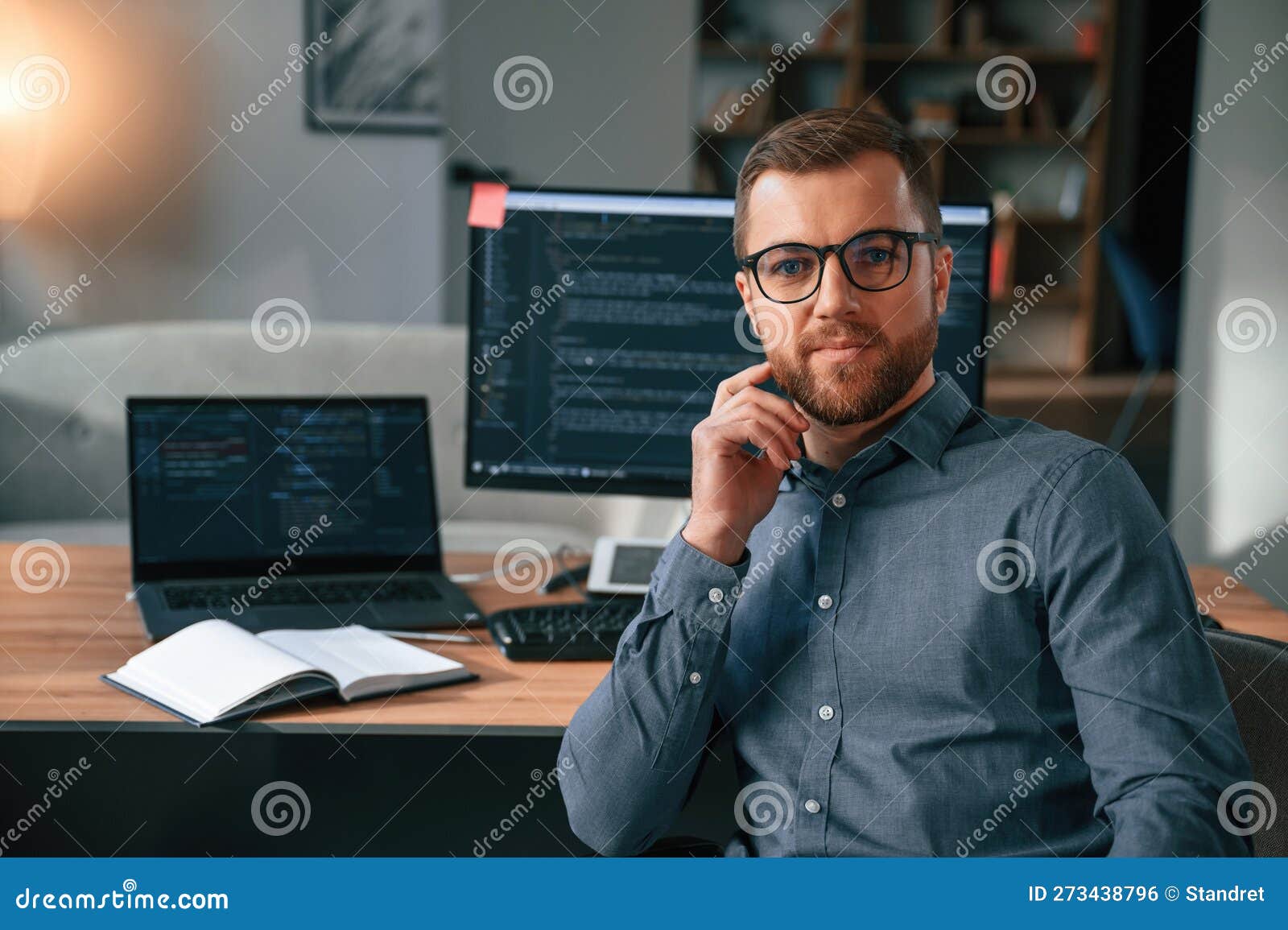 Software Developer is Sitting and Posing. Man in Formal Clothes is ...