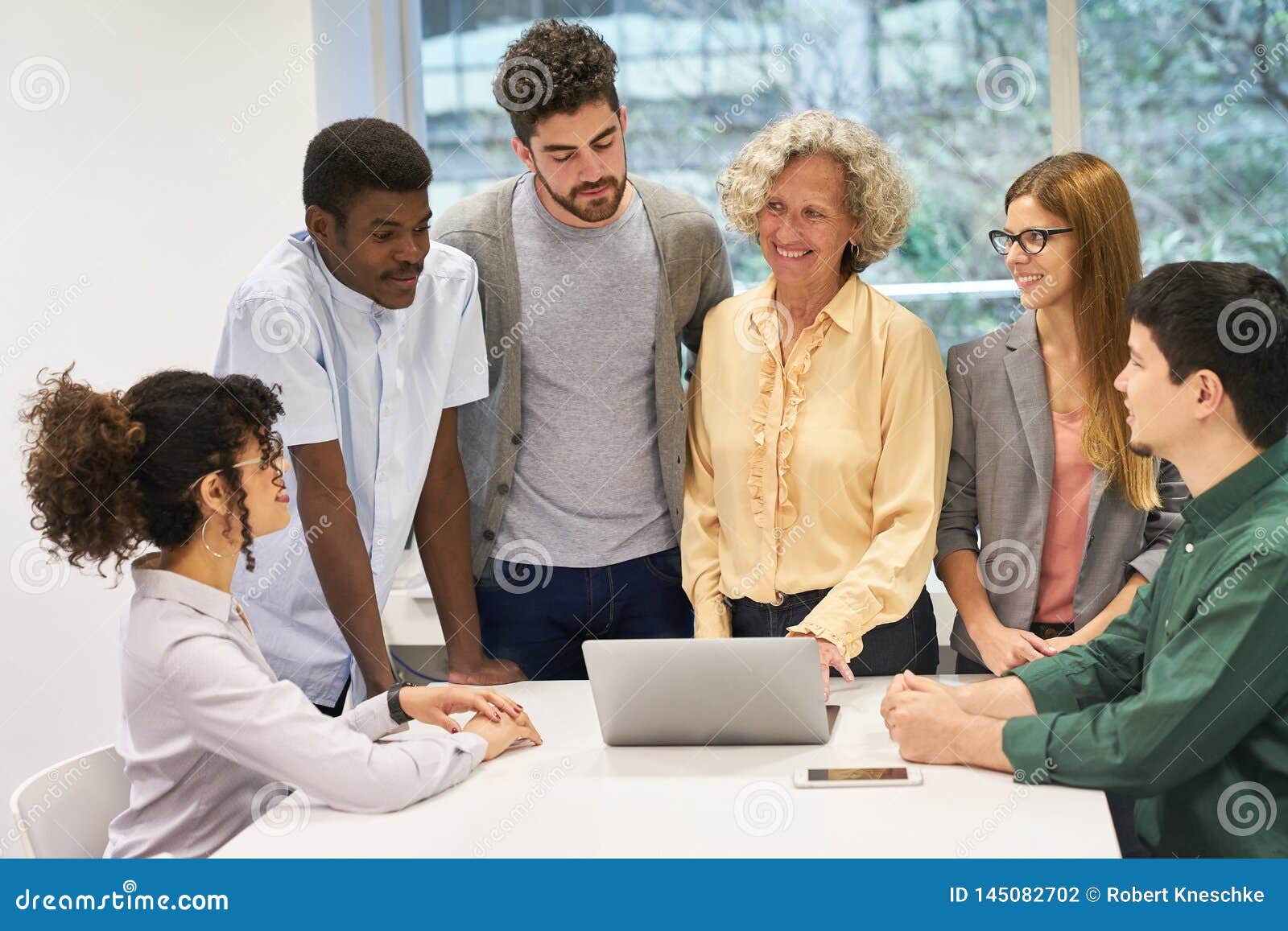 Software Developer Team Looks at a Laptop Stock Photo - Image of laptop ...