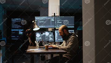 Software Developer Typing Source Code on Laptop and Multiple Monitors Stock Photo - Image of ...