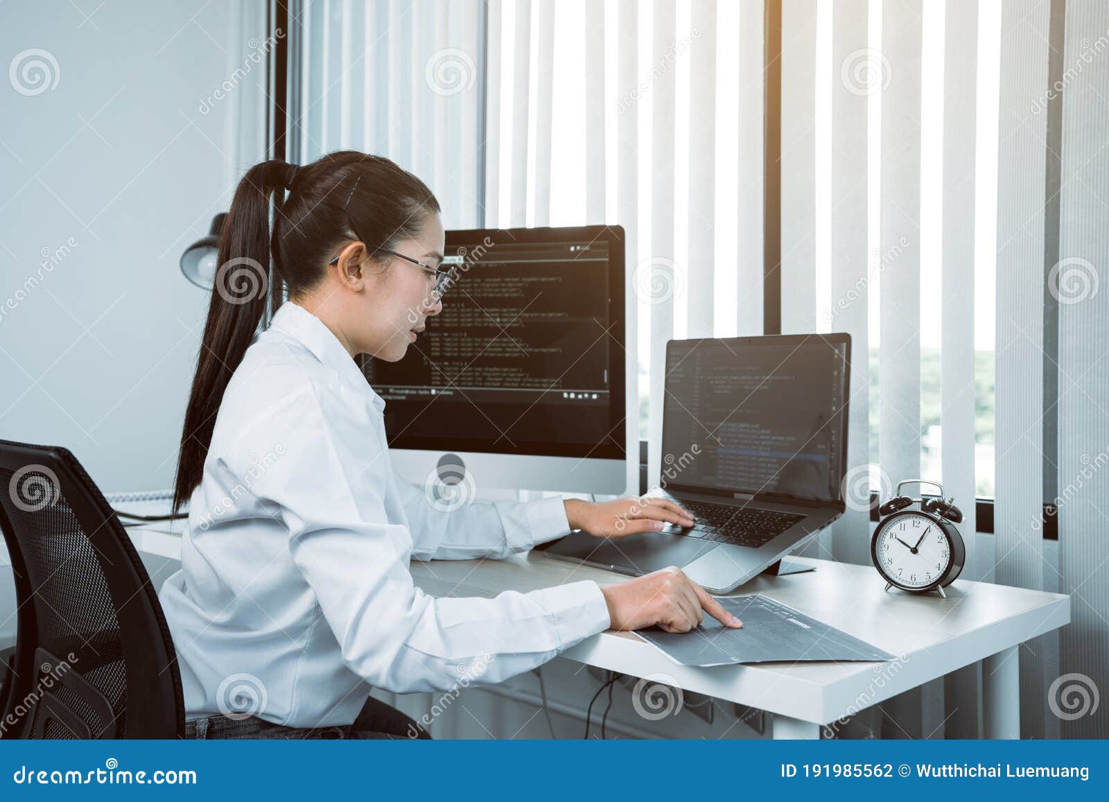 Software Developers Are Analyzing About The Code Written Into The Program On The Computer In