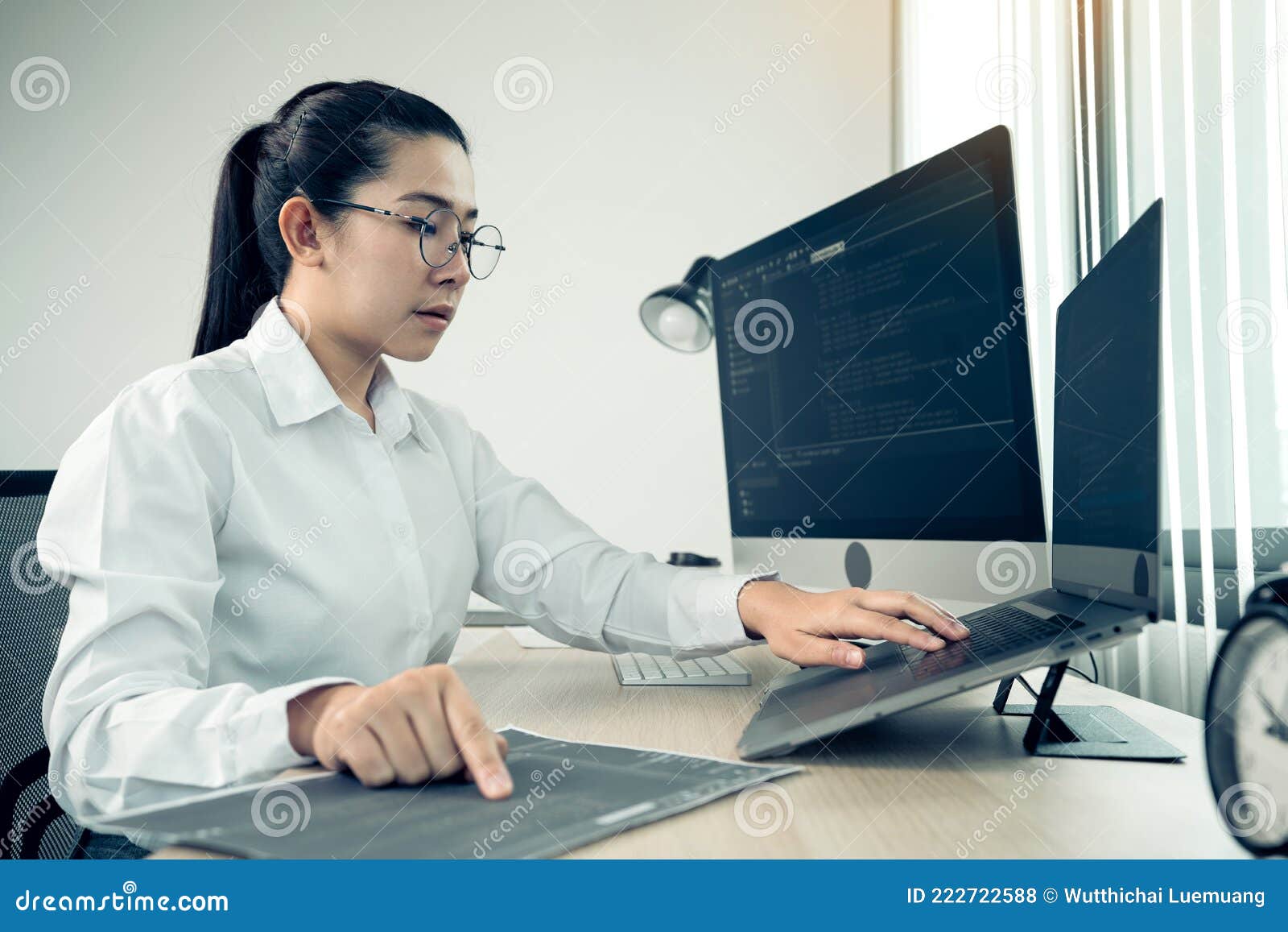 Software Developers Are Analyzing About The Code Written Into The Program On The Computer In