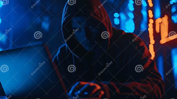 Software Developers Intensely Reviewing Code On A Large Screen In A High Tech Office