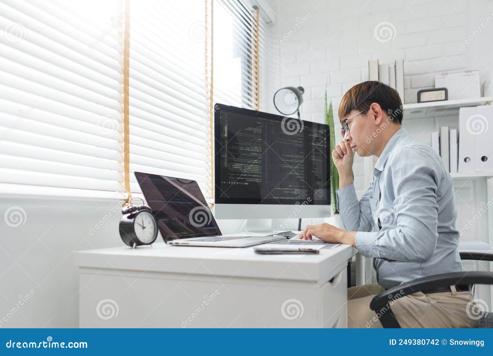 Software Development Concept, Male Programmer Looking Data on Laptop ... Software Development Concept, Male Programmer Looking Data on Laptop ...