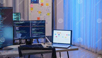 Software Development Office Workstation Setup with Multiple Monitors Displaying Code and ...