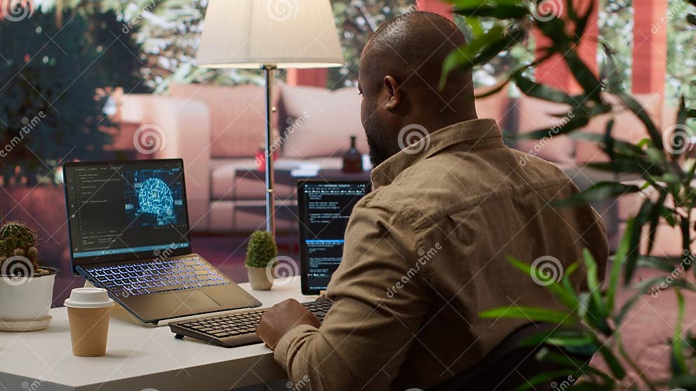 Software Engineer Coding on a Laptop Focusing on Deep Learning Stock ...