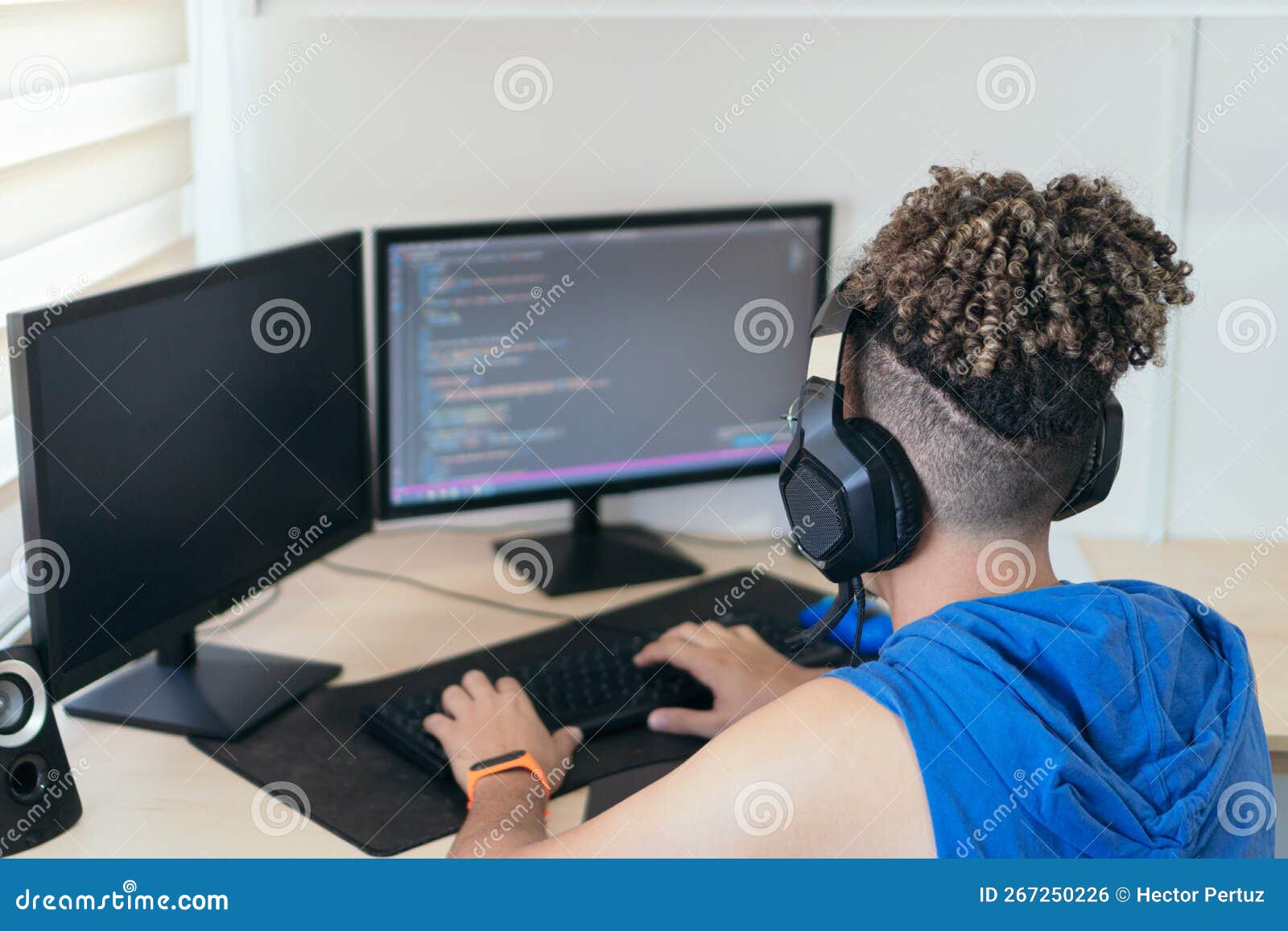 Software Engineer Sitting At Desk And Typing On Computer Keyboard While Creating Code While