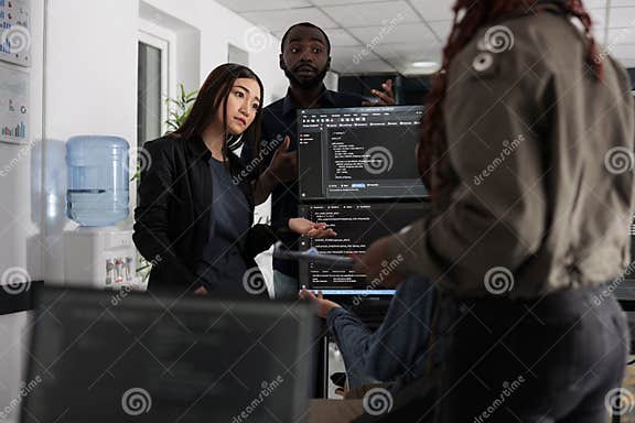 Software Engineers Collaborating On Coding Project Talking About Programming Algorithm Stock