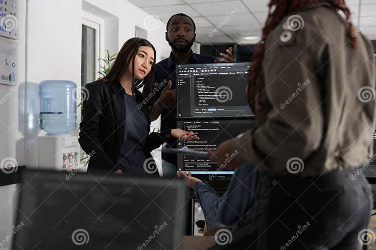 Software Engineers Collaborating On Coding Project Talking About Programming Algorithm Stock