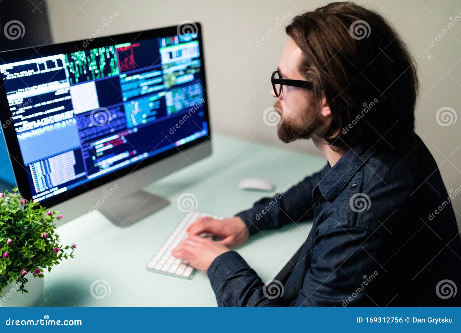 Software Man Developer on the Computer Screen and is Analyzing the Code ...