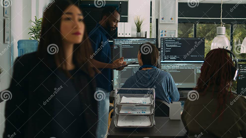 Software Programmers Talking about Algorithms on Big Screen and Tablet Stock Photo - Image of ...