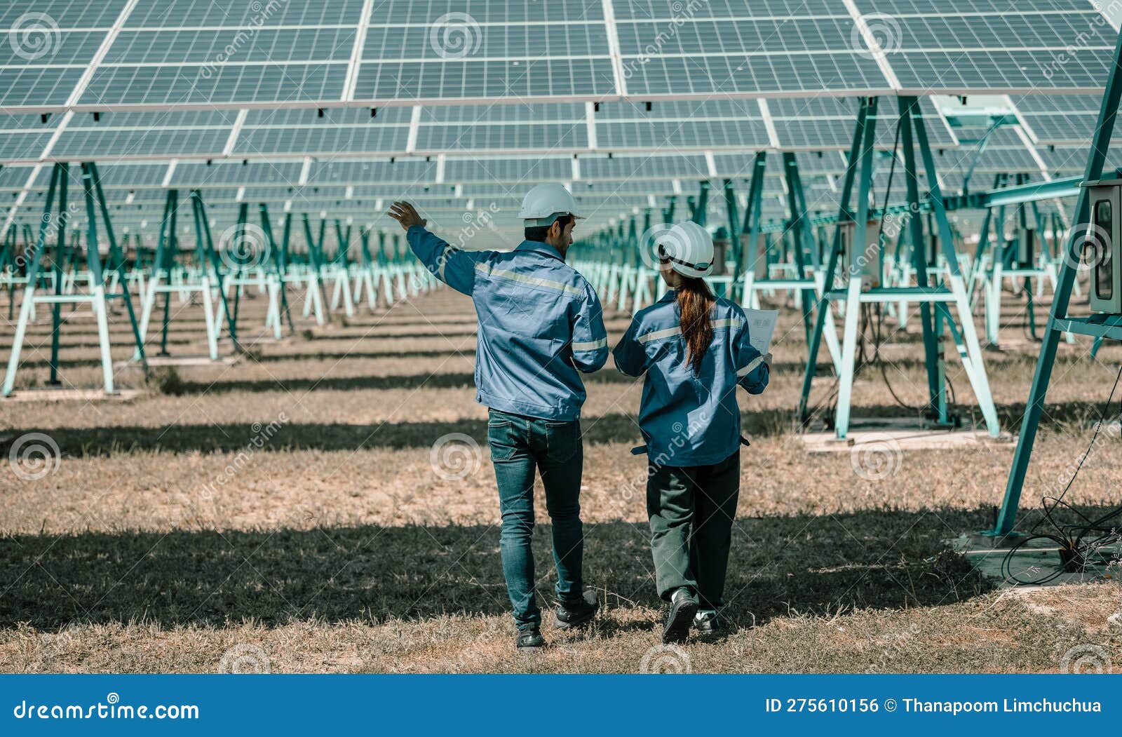Solar Design Engineers Visually Inspect Photovoltaic Array Installation ...