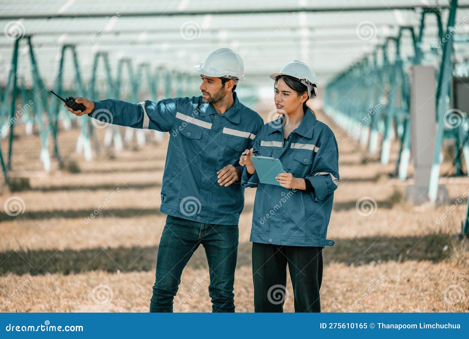Solar Design Engineers Visually Inspect Photovoltaic Array Installation ...