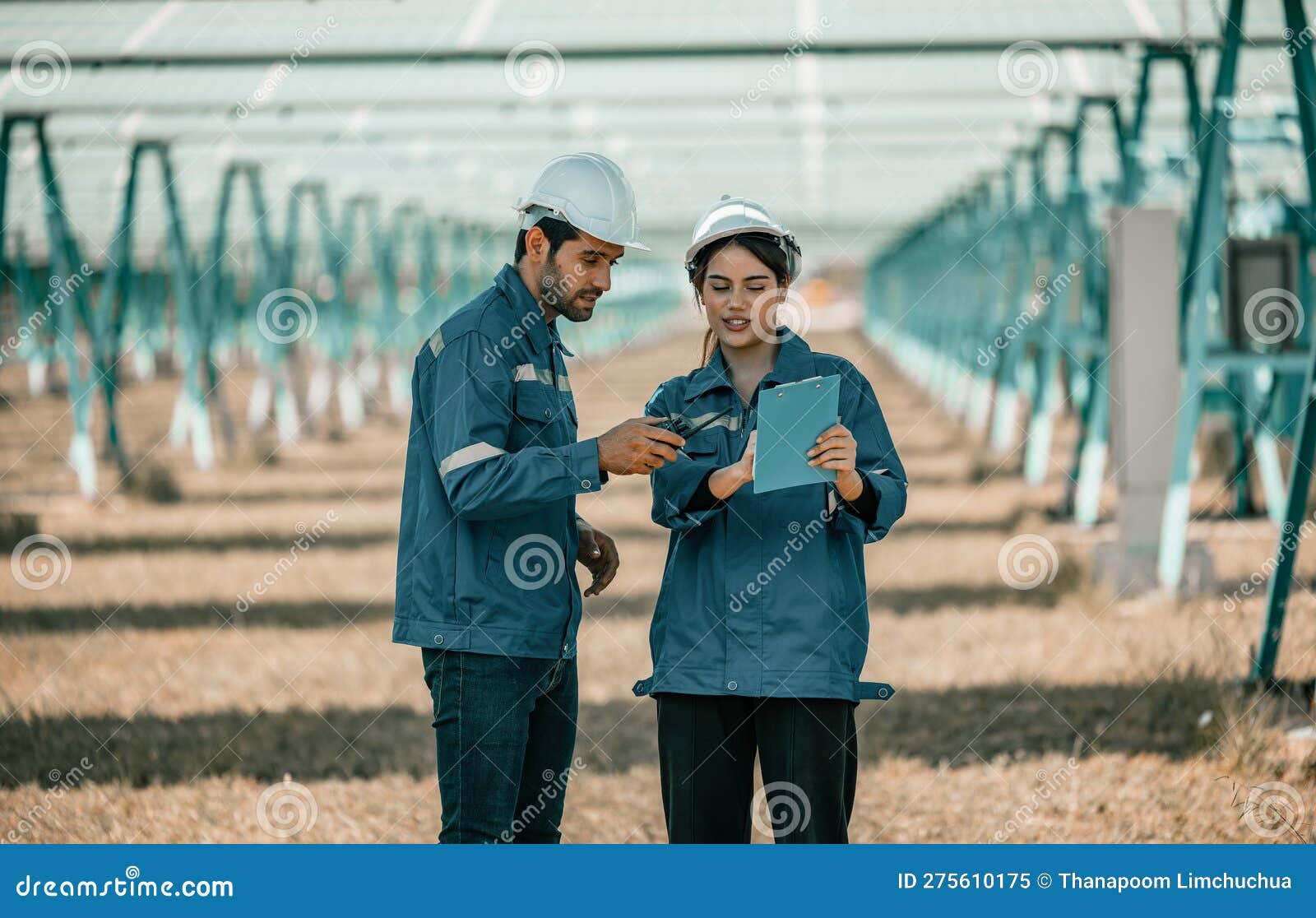 Solar Design Engineers Visually Inspect Photovoltaic Array Installation ...