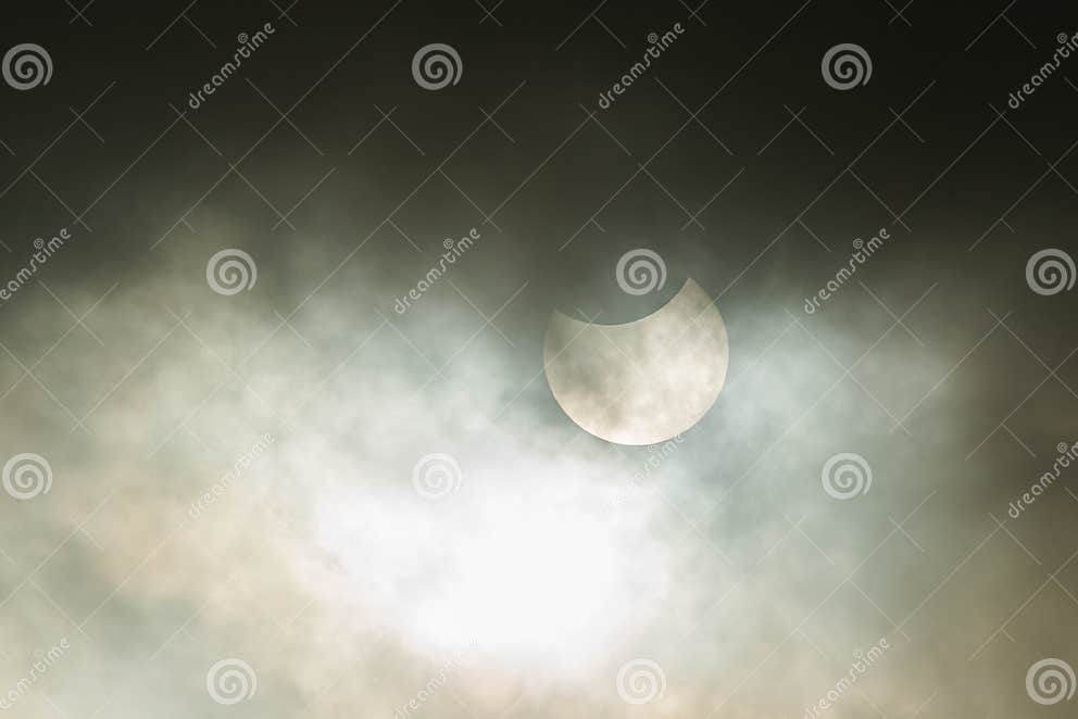 Solar Eclipse on a Cloudy Day. Stock Photo - Image of astrophotography, cloudiness: 259891152