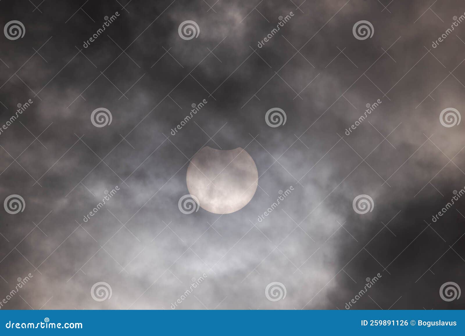 Solar Eclipse on a Cloudy Day. Stock Photo - Image of partial, dark: 259891126