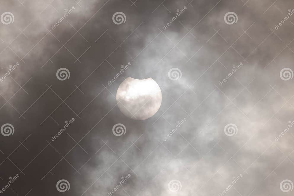 Solar Eclipse on a Cloudy Day. Stock Photo - Image of astrophotography, thin: 259891124