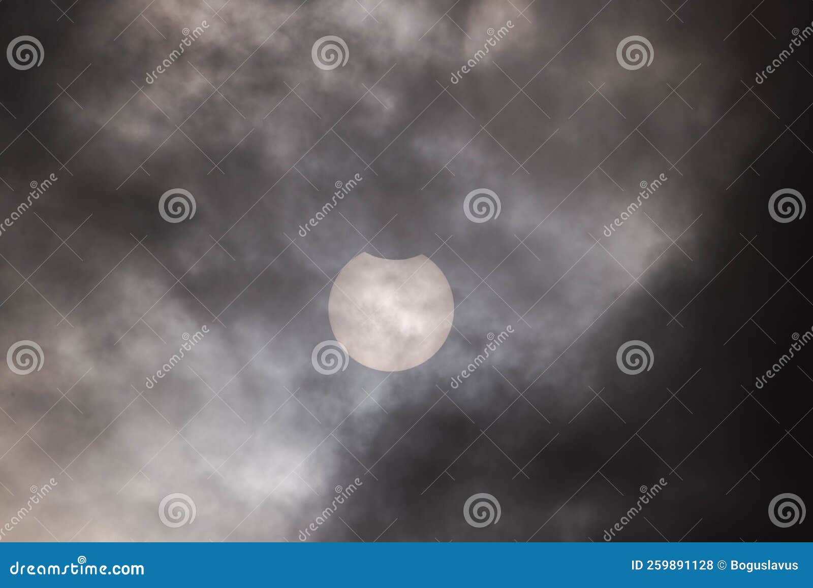Solar Eclipse on a Cloudy Day. Stock Photo - Image of glare, eclipse: 259891128