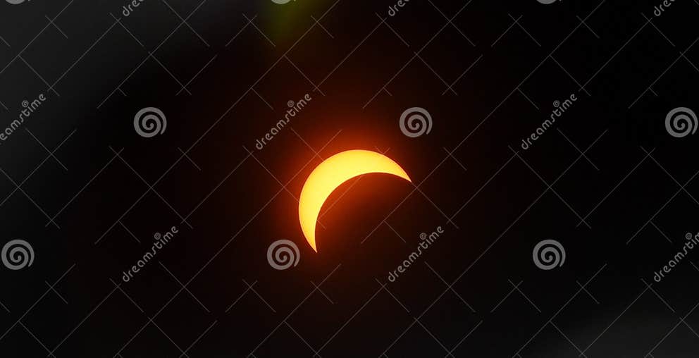Solar Eclipse with a Glowing Crescent in the Dark Sky Stock Image ...