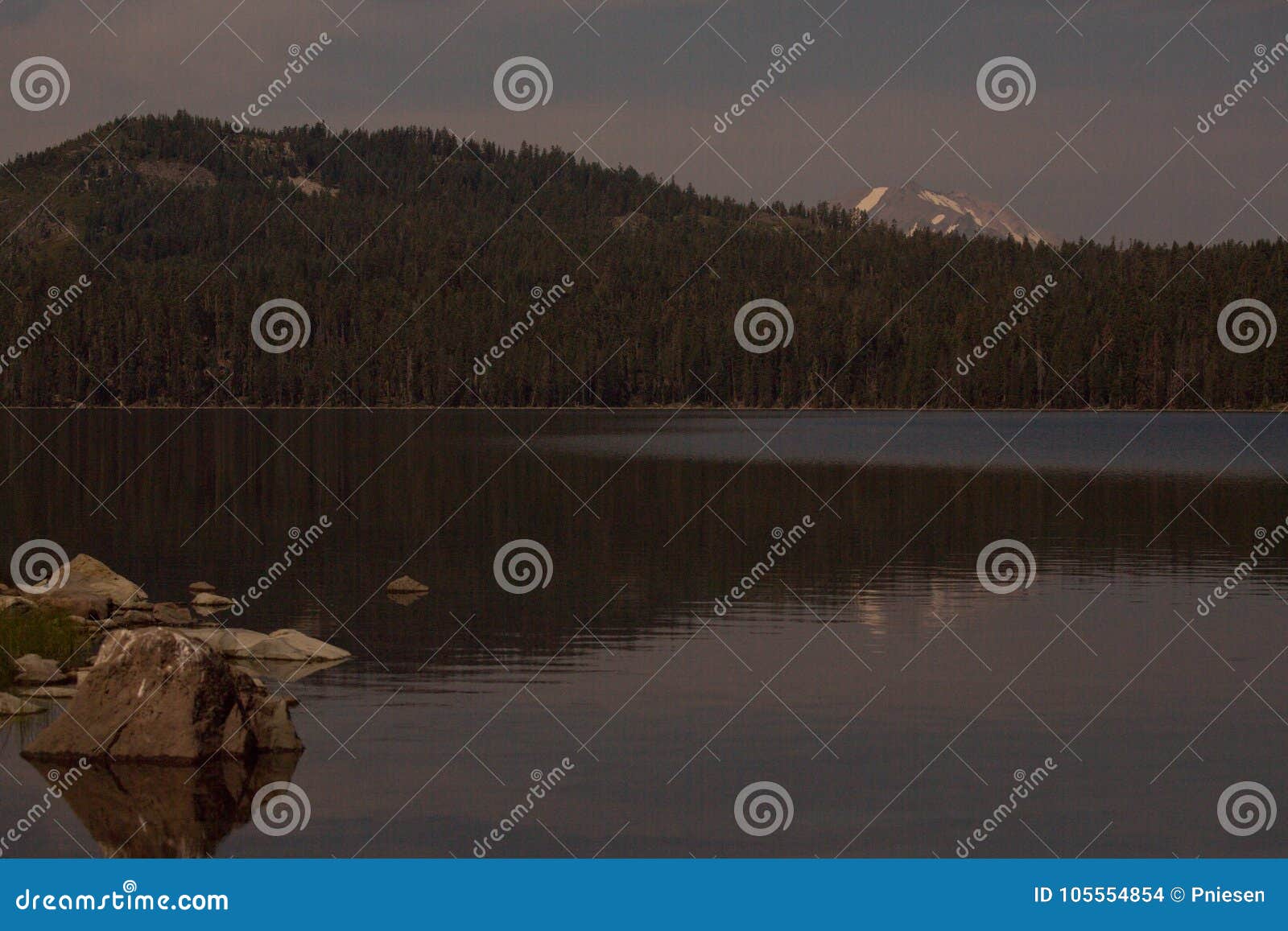 Solar Eclipse Makes it Seem Like Sunset on Alpine Lake in Mid Afternoon ...