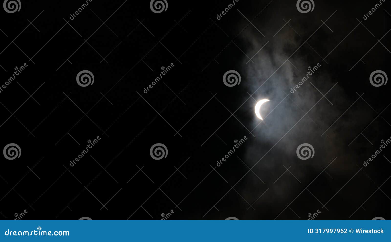 Solar Eclipse with the Moon Shining through Dark Clouds in Waco, Texas ...
