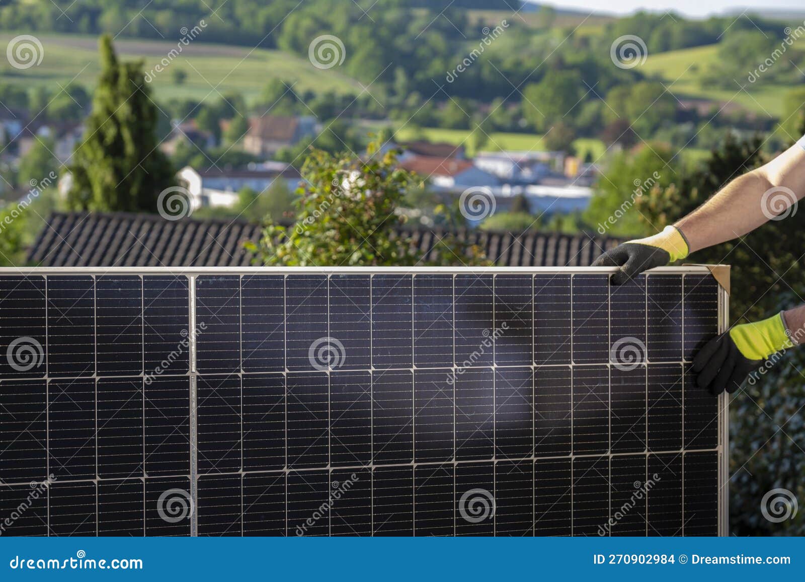 Solar Energy. Solar Panel in the Hands of a Worker on City Background ...