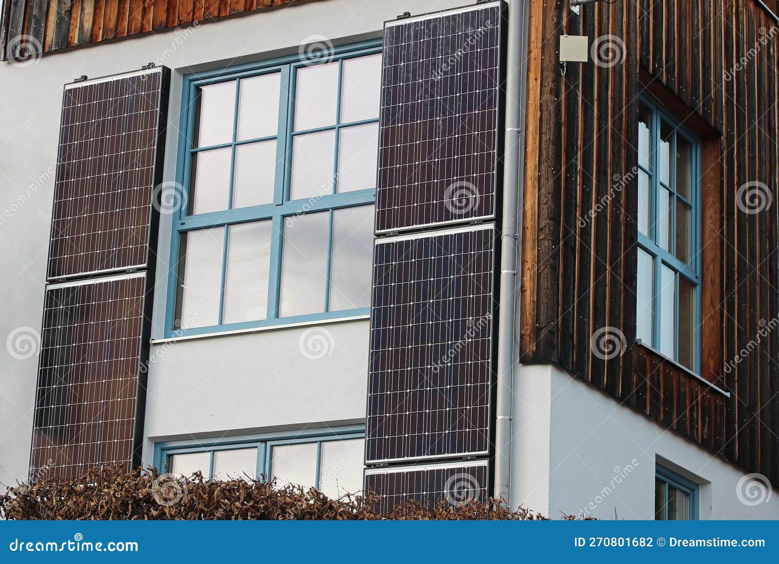 Solar Modules for Power Generation on a House Wall Stock Photo - Image ...