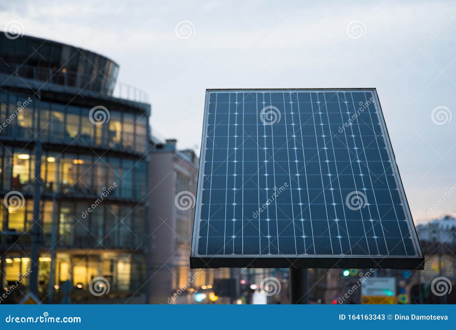 Solar Panel on the Background of a Building Illuminated by Electricity ...